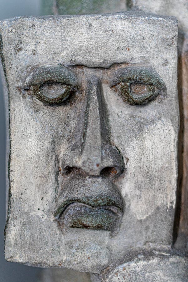 Stone Artwork of Human Faces Stacked in a Column. Editorial Image ...
