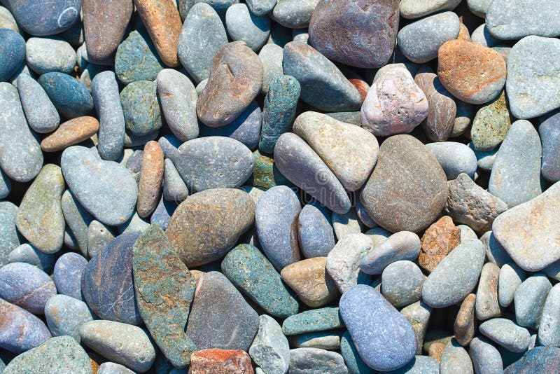 Tumbled Smooth River Stones with White Mineral Stripe Inclusions Stock ...