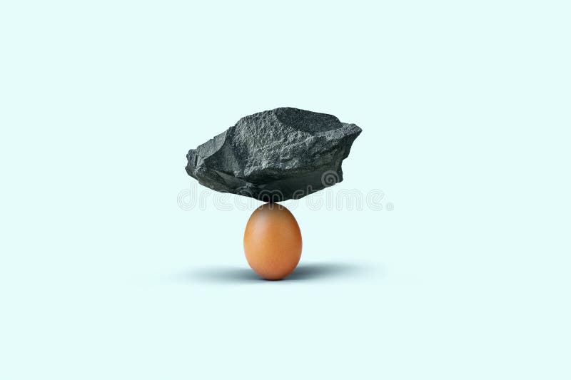 Stone Balances on an Egg on a Blue Background. Insurance, Concept ...