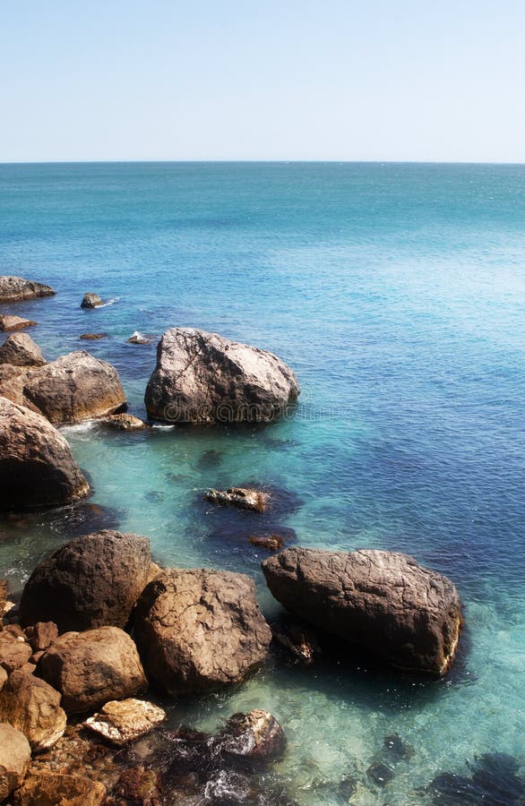 Stone beach stock photo. Image of strong, clouds, water - 10970298