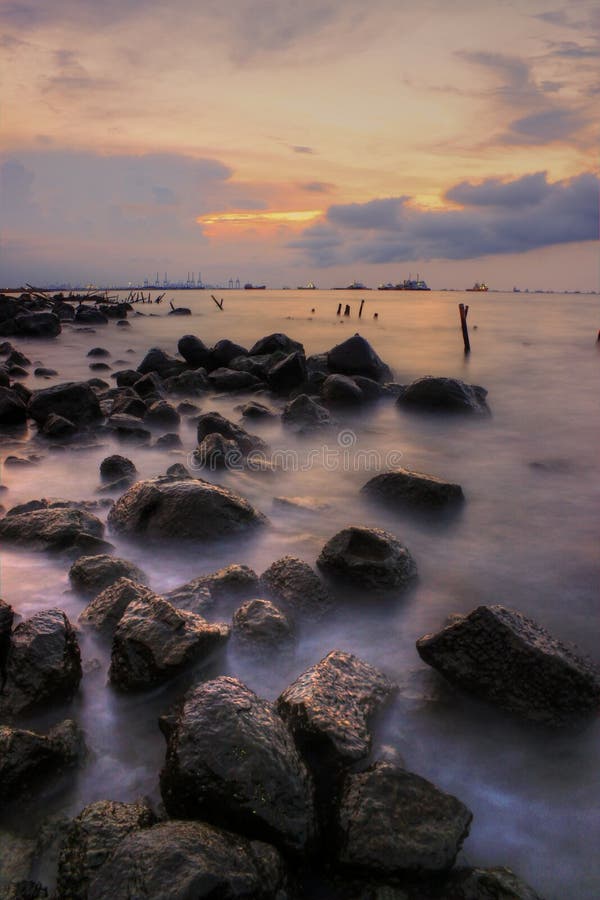 Stone at Beach Sunsets View Wave Stock Image - Image of sunsets, beach ...