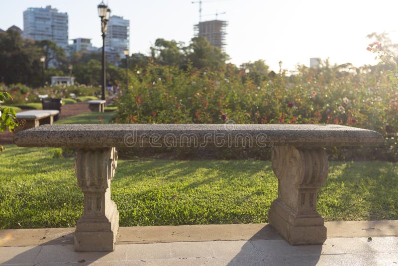 Stone Bench in City Park at Sunset Stock Photo - Image of grass, people ...