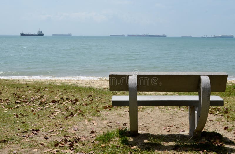 Stone bench facing sea stock photo. Image of chair, coast - 50137390
