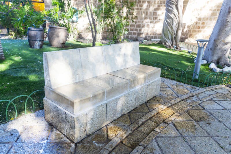 A stone bench stock image. Image of relaxation, turf - 356987187