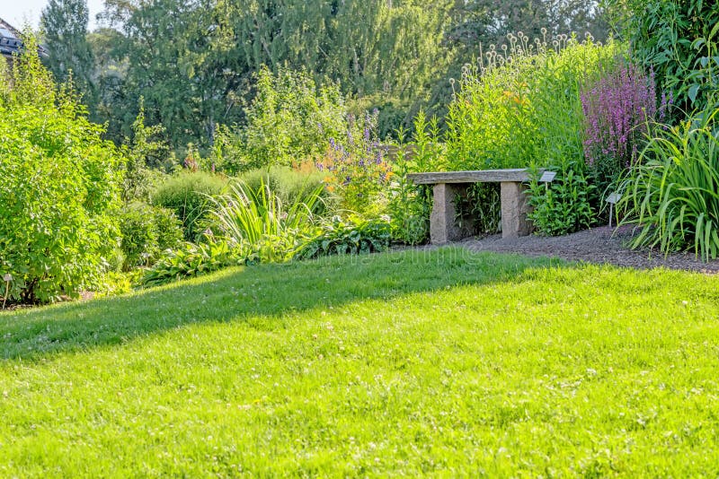 Stone bench at park stock image. Image of beauty, plant - 52457525