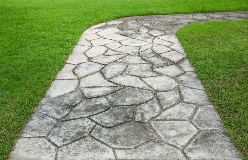 The Stone Block Walk Path in the Park with Green Grass Stock Photo ...