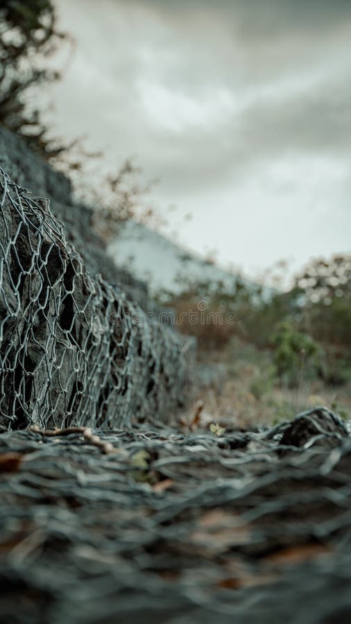 Stones held by netting stock photo. Image of stones - 295303178