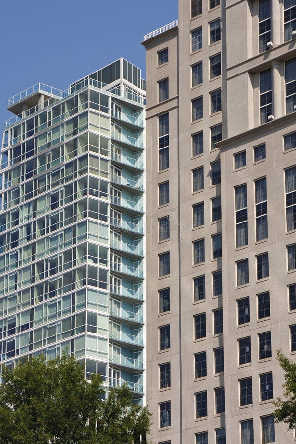 Stone and Blue Glass Facades on Buildings Stock Image - Image of blue ...