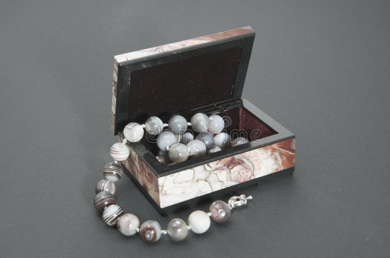 Stone box with the beads. stock image. Image of brass - 28616605