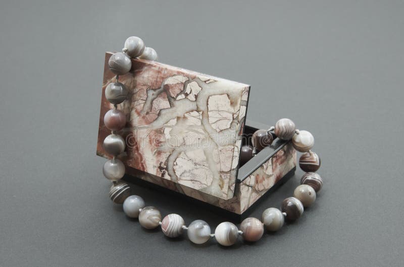 Stone box with the beads. stock image. Image of brass - 28616613