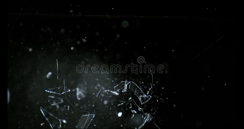 Stone Breaking Pane of Glass Against Black Background Stock Photo ...
