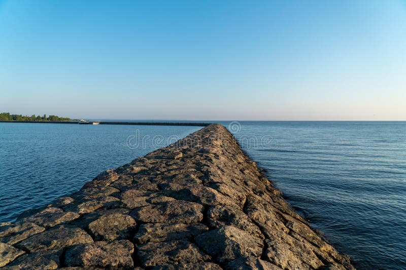 Stone Mole Bund on Lake Water Stock Photo - Image of rocks, tower ...