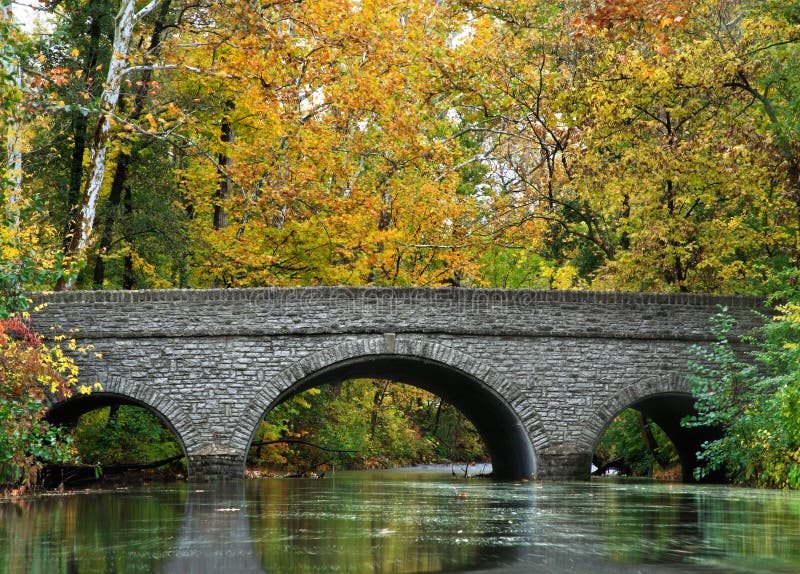 Very Old Stone Bridge Over the Quiet Lake with Its Reflection in the ...