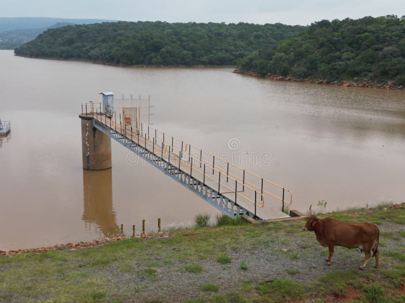 Stone Bridge and a Building Over a River Stock Photo - Image of ...