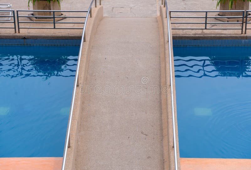 Stone Bridge Crossing on Swimming Pool. Stock Photo - Image of chair ...