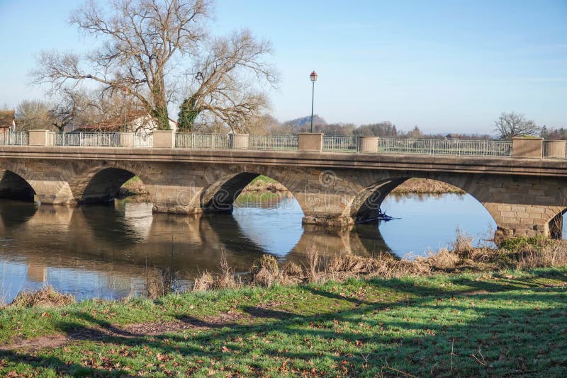 Stone Bridge with Multiple Arches Over a River Under the Blue Sky Stock ...