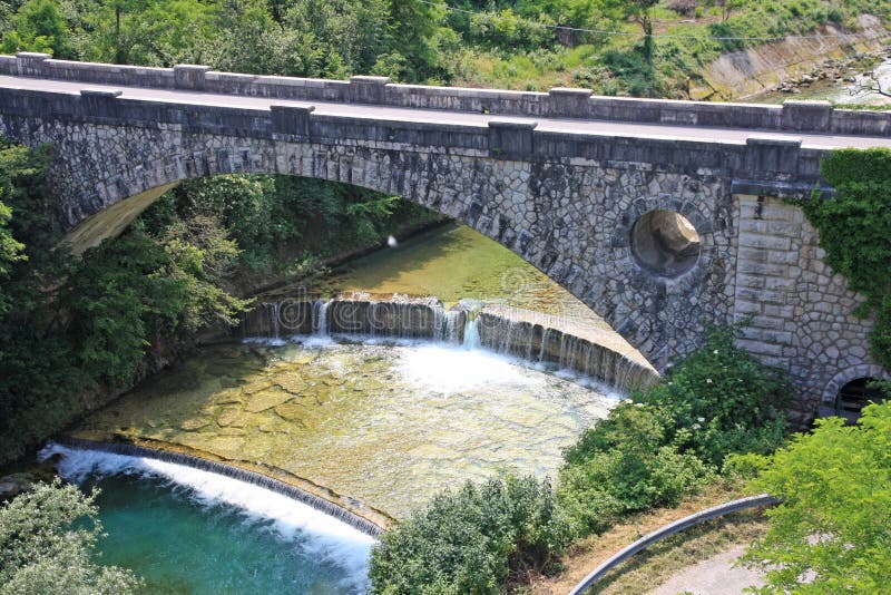 Stone Bridge Over the Brook in the Mountains with Stock Image - Image ...