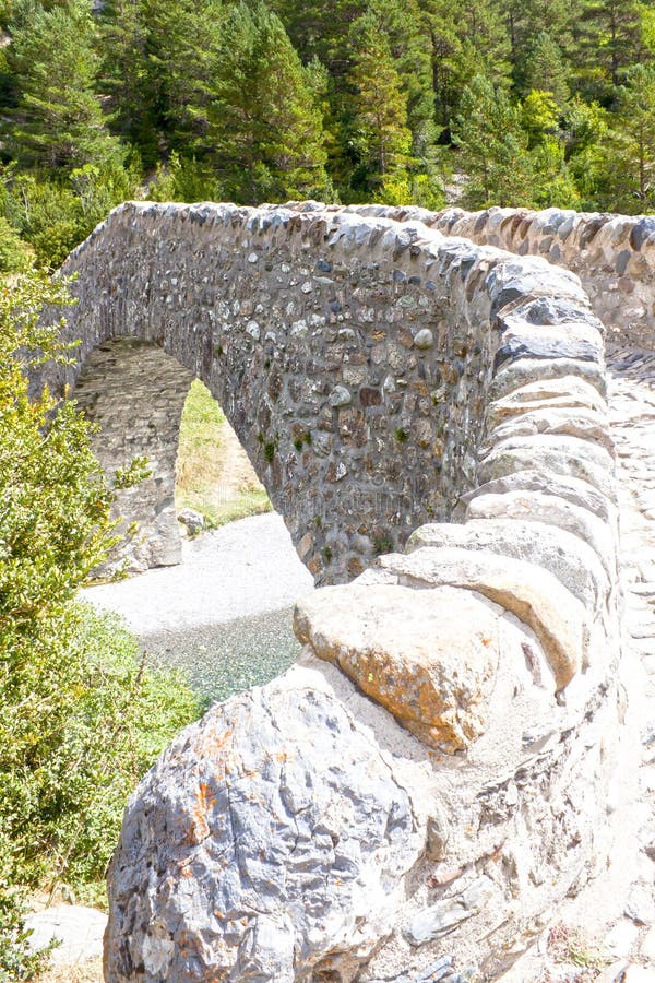 Stone Bridge Over a River with the Forest Behind Stock Image - Image of ...