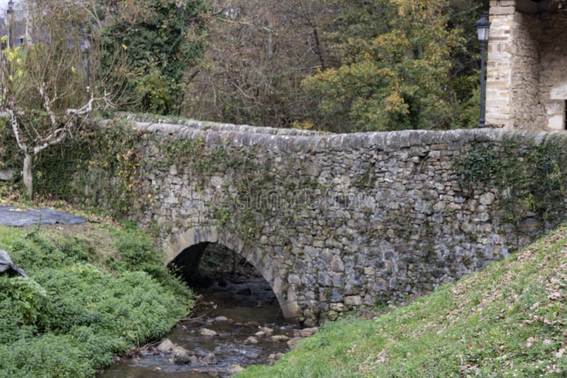 Stone bridge on the river stock photo. Image of arroyo - 144419696