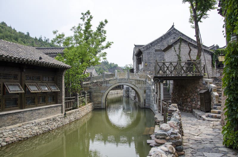 Stone Bridge of Waterside Town Stock Image - Image of waterside, vine ...