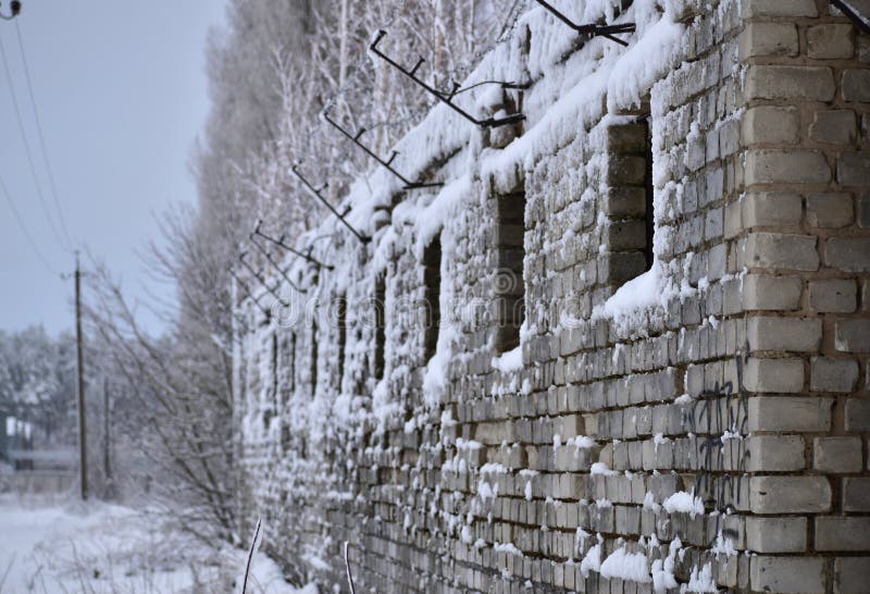 A Stone Building Whose Walls are Covered with Snow. Stock Image - Image ...