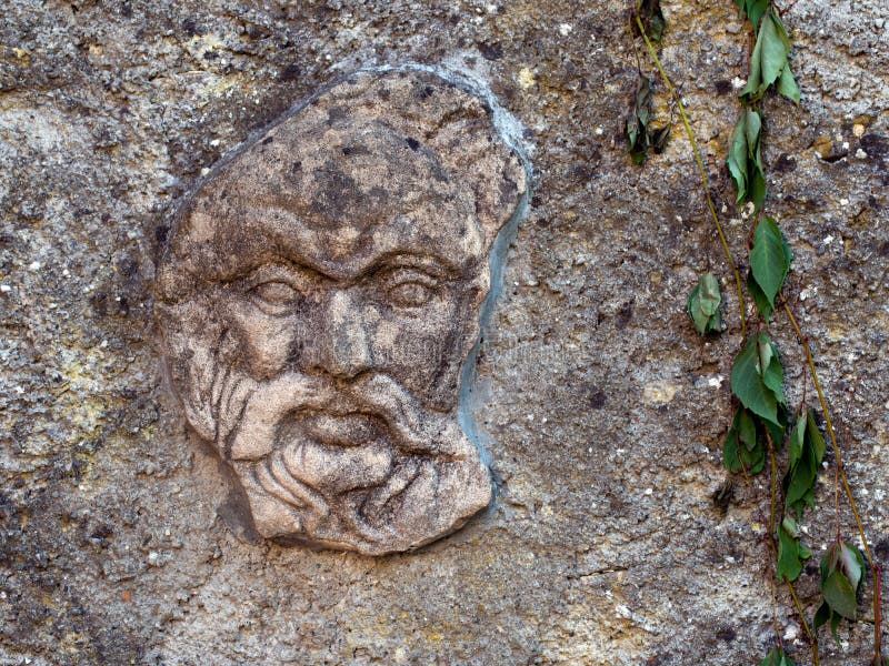 Stone Carved Face, Embedded in Wall. Stock Photo - Image of ...