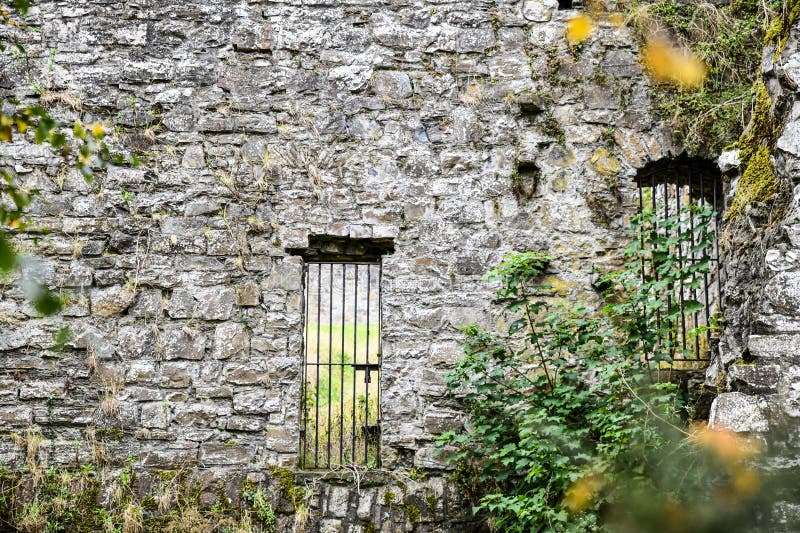 Stone Castle Wall with Iron Bar Window and Door Stock Photo - Image of ...