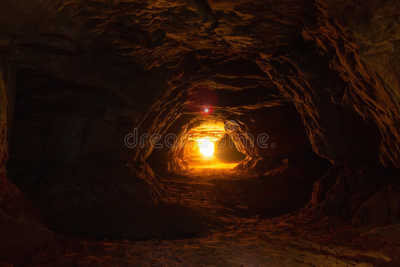 Stone Cave Lit by Warm Light Stock Photo - Image of limestone, caving ...