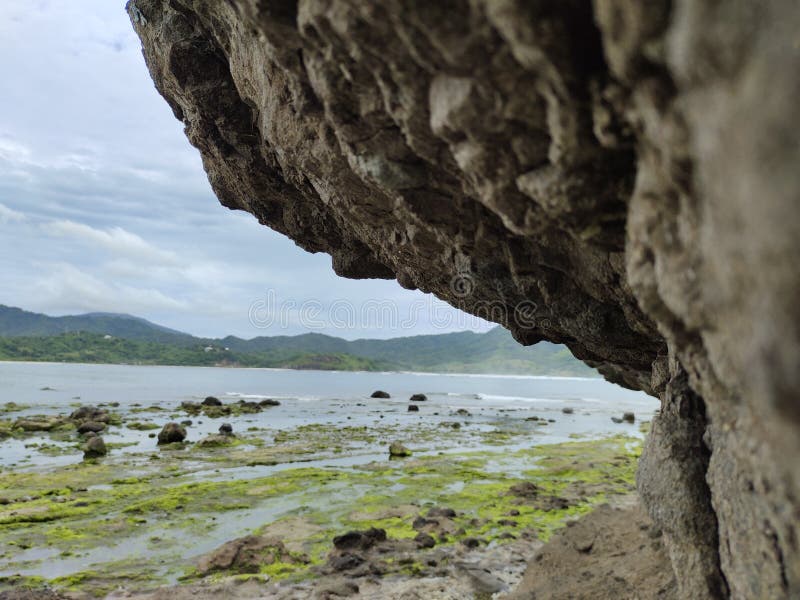Stone Cave on a Rocky Beach Which is Impressive Stock Photo - Image of ...