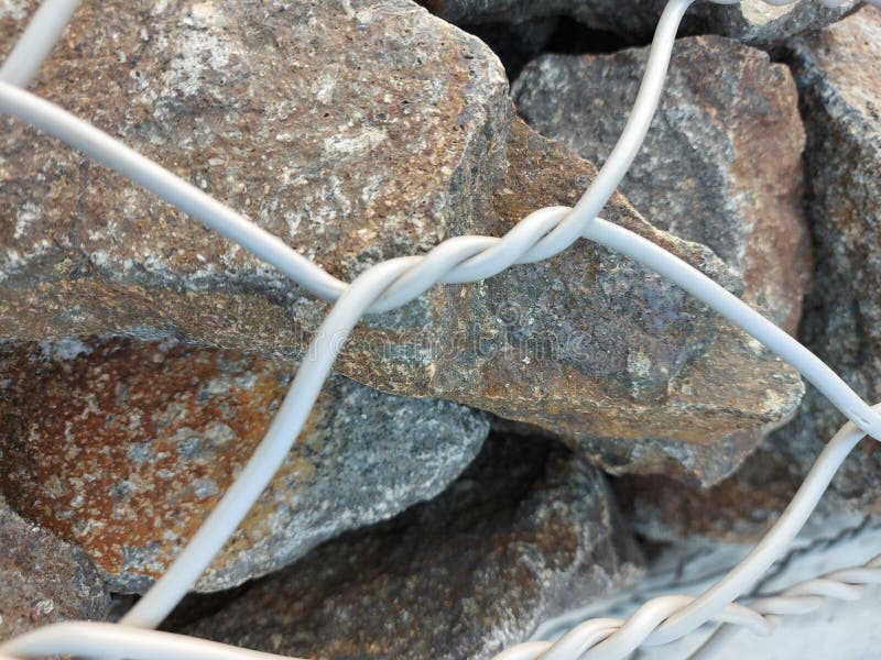 Stone in Chain stock image. Image of asphalt, rock, iron - 227739255