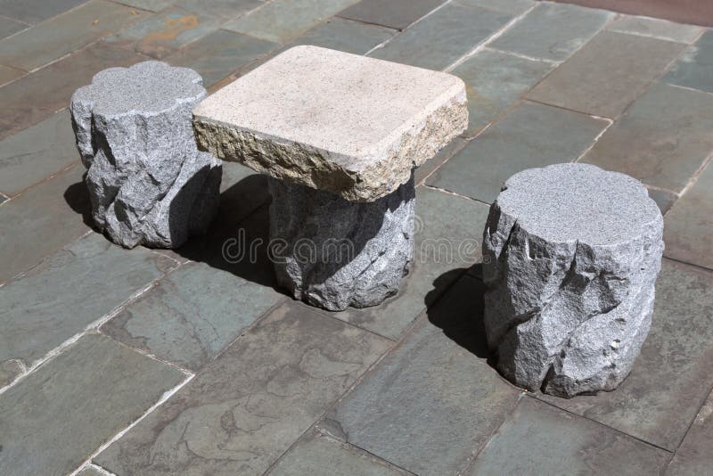 Stone chairs and table stock image. Image of furniture - 90721507