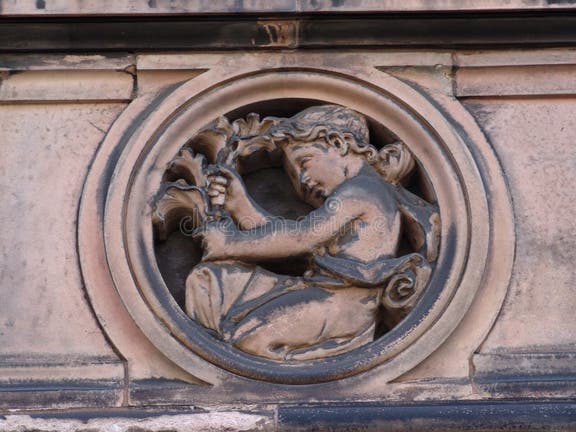 Stone Child Motif on Building Stock Photo - Image of branch, myth: 1010186