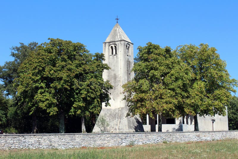 Stone Church Tower Behind Tall Trees Stock Photo - Image of church ...