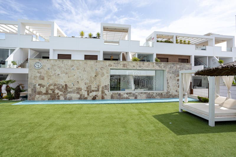 Stone-clad Spa Wall with Waterfall and Lawn Stock Image - Image of ...