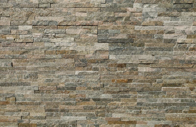 Stone Cladding Wall Made of Striped Stacked Bricks of Multicolor Rocks ...