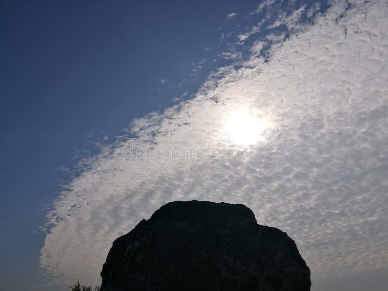 Stone and clouds stock image. Image of colorful, contrast - 102599905