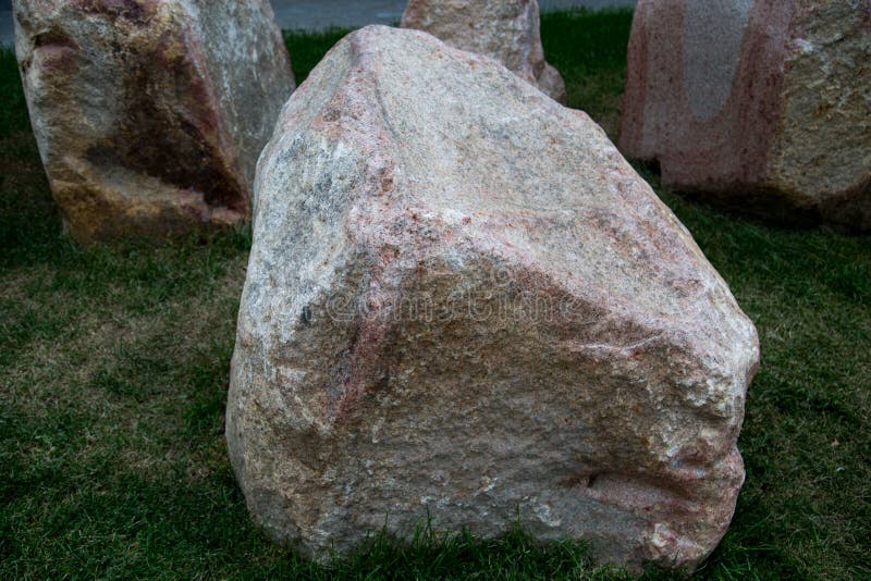 The Stone is a Cobblestone of Pink Granite on Green Grass. Construction ...
