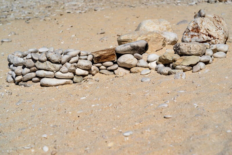 Stone composition on sand stock photo. Image of cobble - 129822030