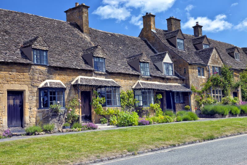 Stone Cottages in Rural English Village by a Road Stock Photo - Image ...