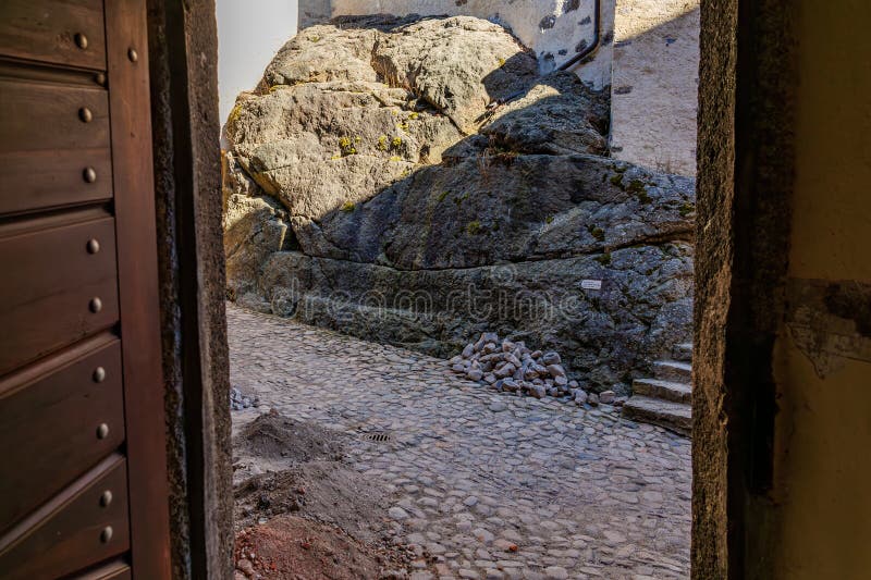 Stone Courtyard View: Rustic Cobblestone Path and Weathered Rock ...
