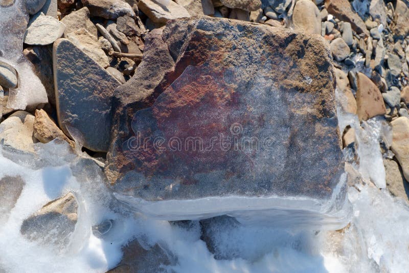 Stone Covered with Transparent Ice with Air Bubbles. Ice Texture Stock ...