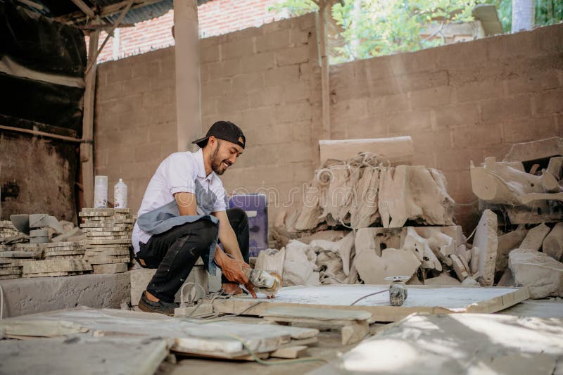 Stone Craft Workers Sit Using Tools while Handling Stone Chunks Stock ...
