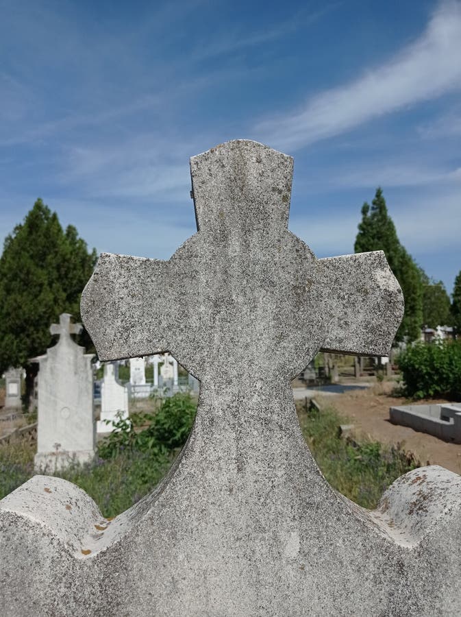 Stone cross in a cemetery stock photo. Image of monument - 249145914