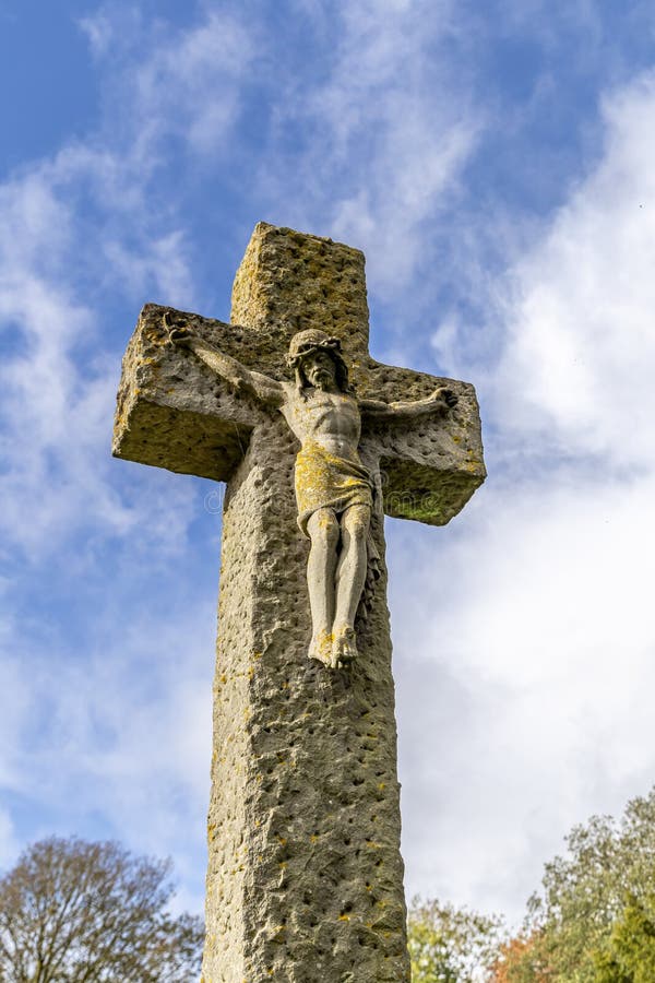 Stone Cross with Jesus Christ on it Stock Photo - Image of monument ...