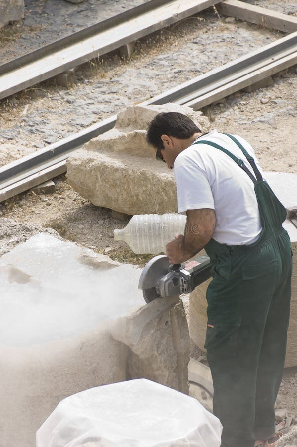 Stone cutter worker editorial photo. Image of tools, action - 25605491