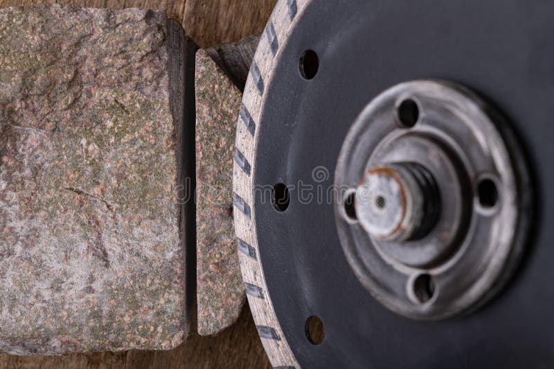 Stone Cutting with a Diamond Disc Mounted in a Grinder. Work in a Stone ...