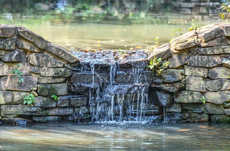 A Stone Dam with a Waterfall. Stock Image - Image of waterfall, feature ...