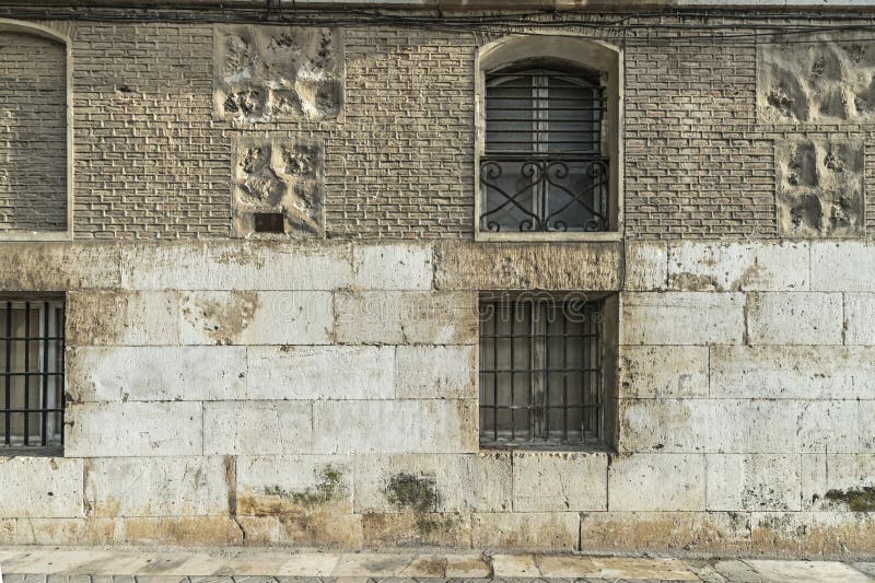 Stone Facades with Barred Windows are Architectural Elements that Give ...