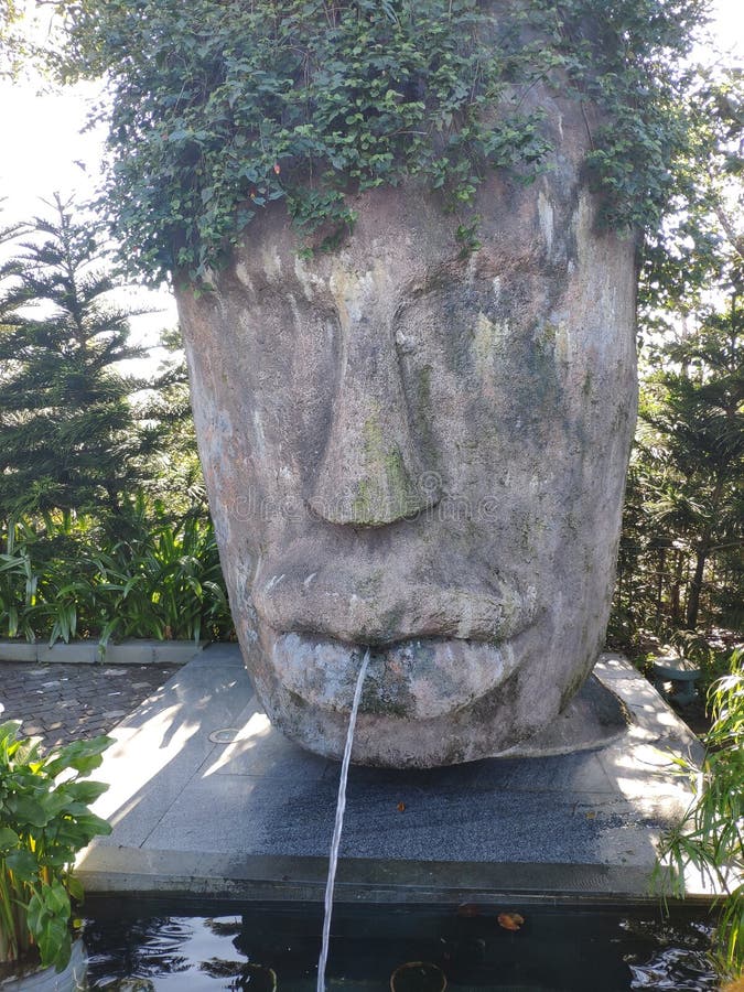 Stone Face Spitting Water Fountain Stock Image - Image of water ...