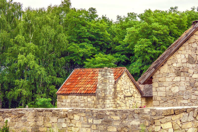 Stone Fence and Give a Red Roof Stock Photo - Image of culture, homes ...